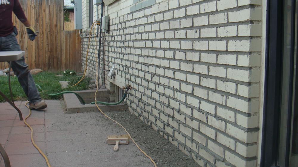 Grind Out Bottom And Tuck Point Four Feet Of Painted Brick